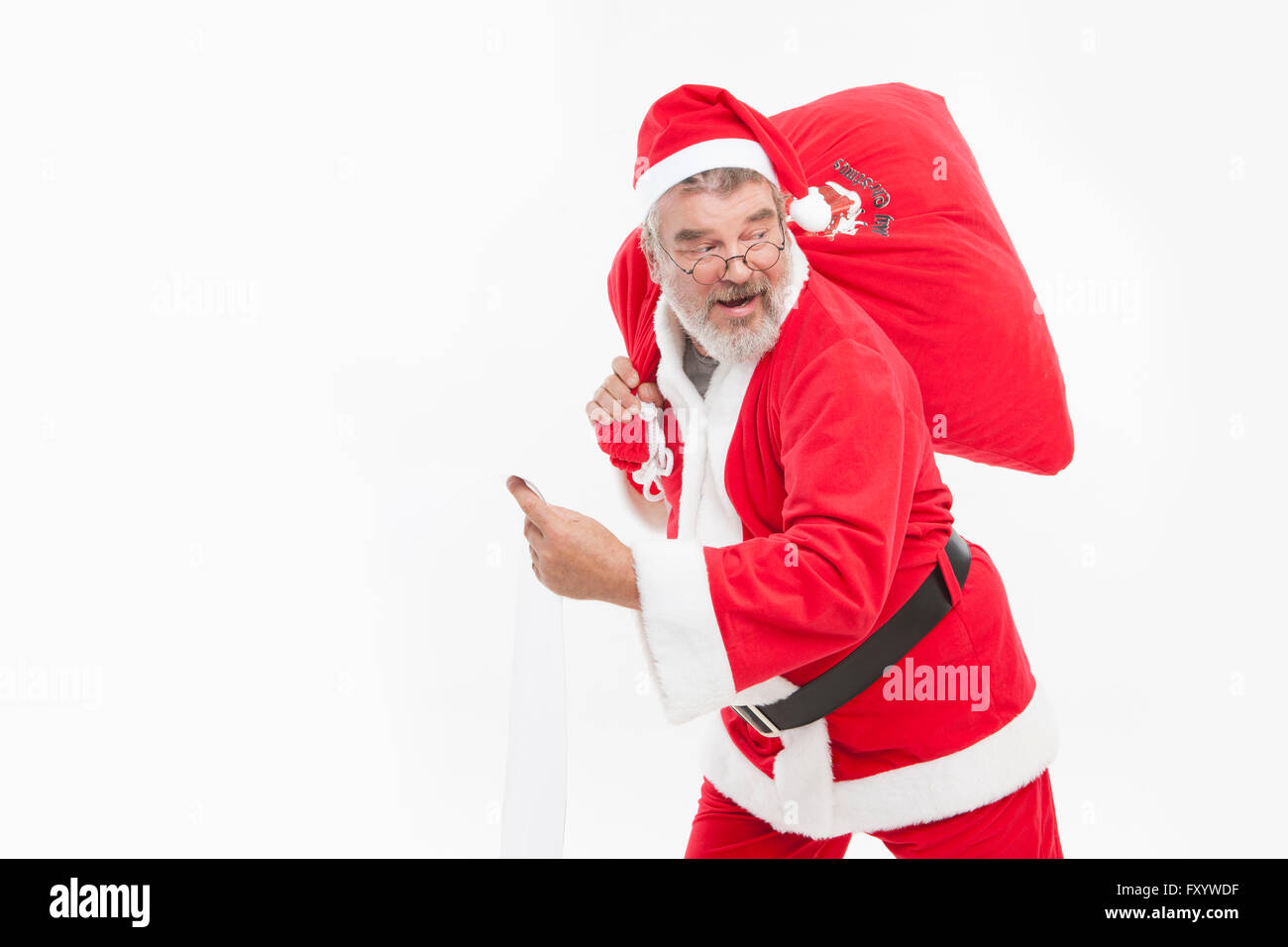 Side view of Santa holding a bag looking back Stock Photo - Alamy