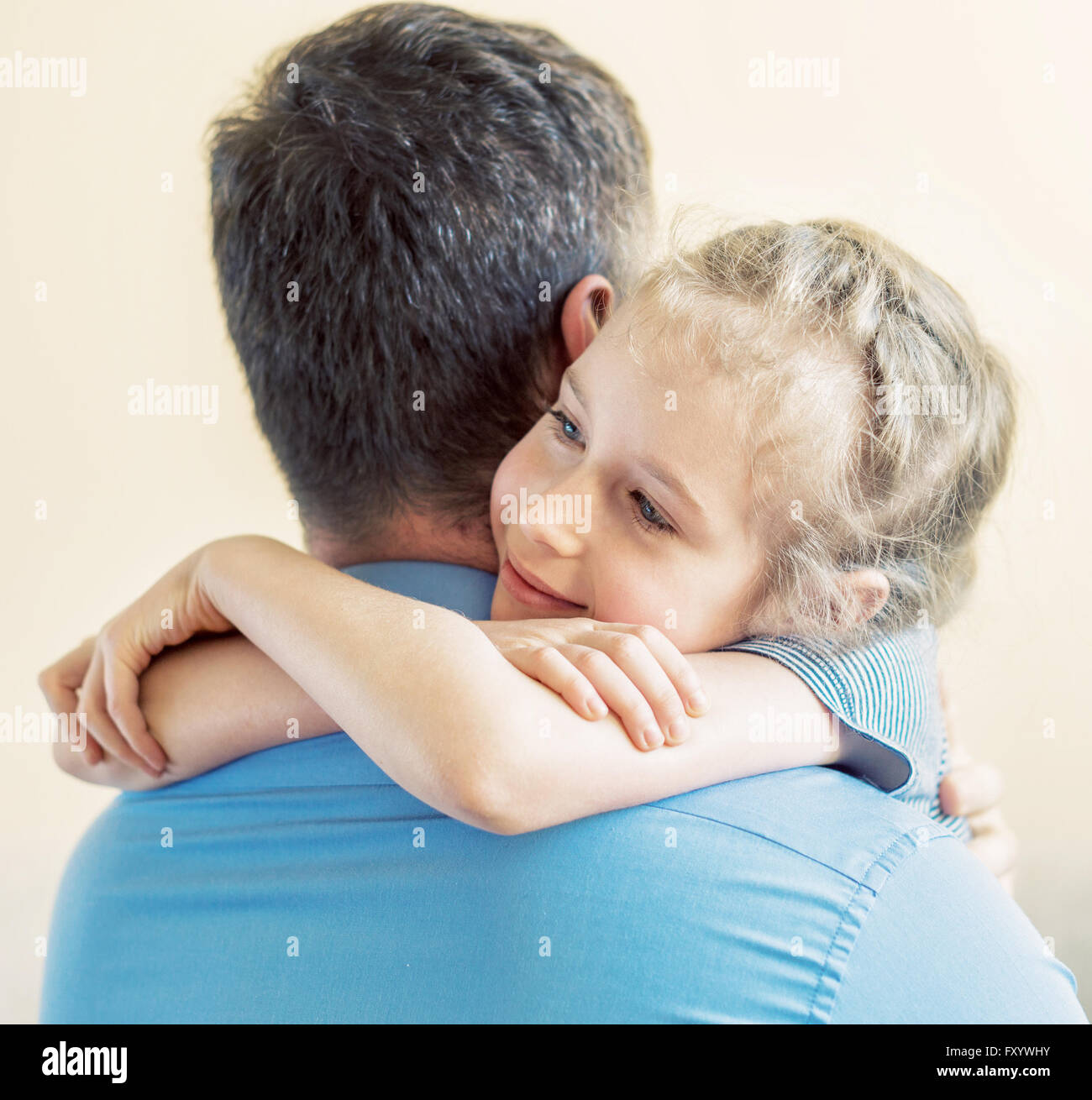 Happy little girl hugging his dad Stock Photo - Alamy