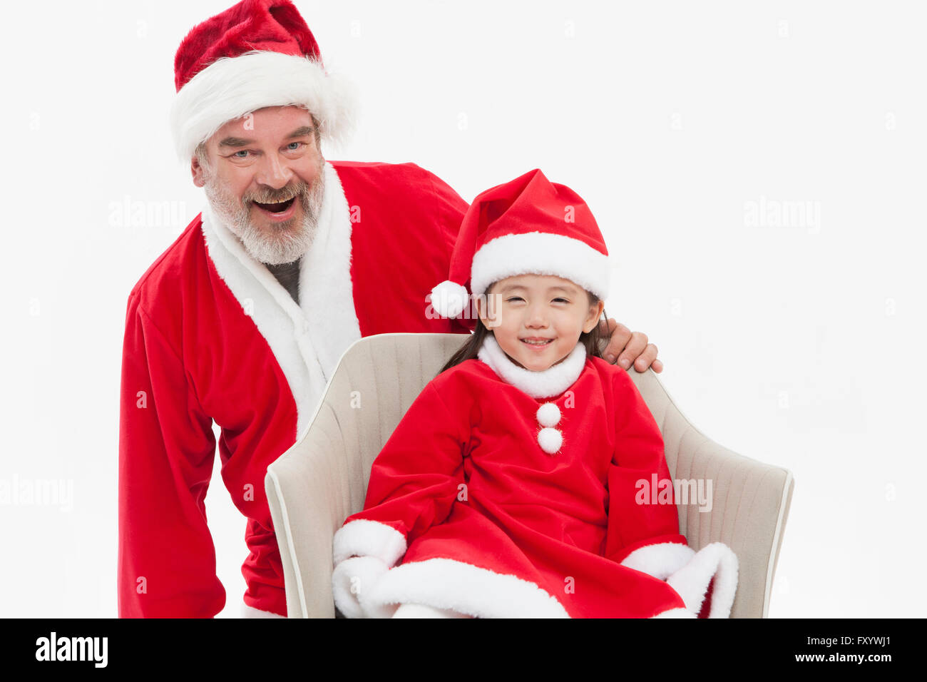 Portrait of smiling Santa and girl staring at front Stock Photo - Alamy