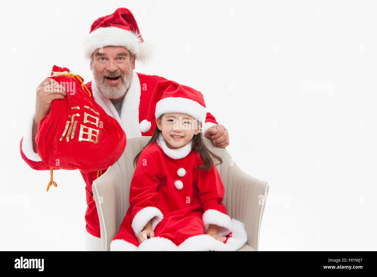 Girl sitting on santa claus hi-res stock photography and images - Alamy