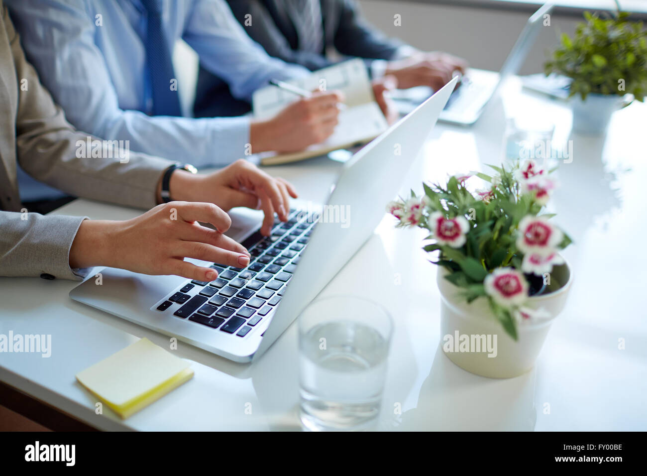 Typing at workplace Stock Photo - Alamy