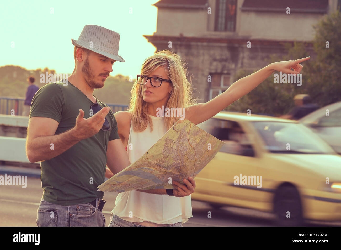 Tourists with city map Stock Photo - Alamy