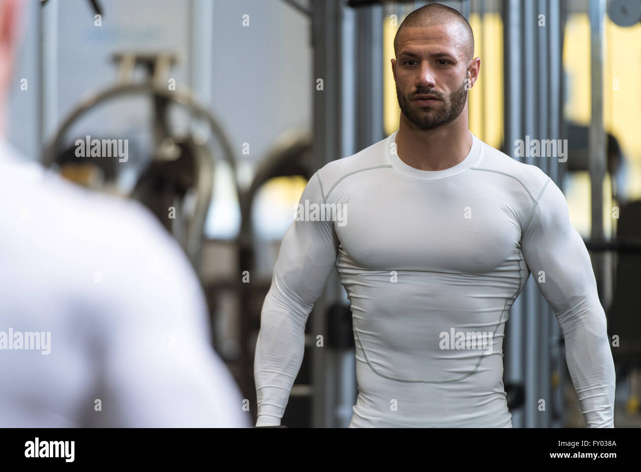 Young Healthy Man Working Out Biceps - Dumbbell Concentration Curls ...