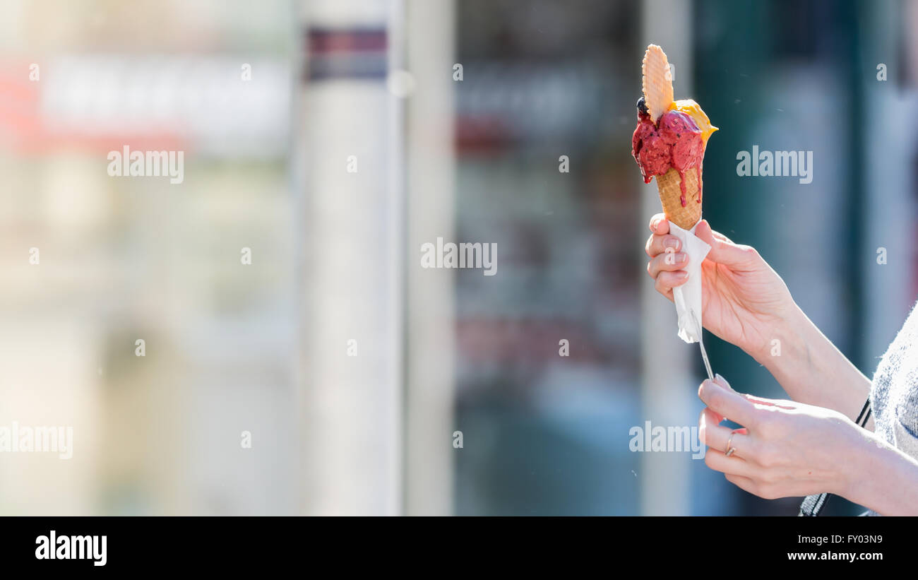 People eating an ice cream outdoor in the street, urban concepts Stock ...