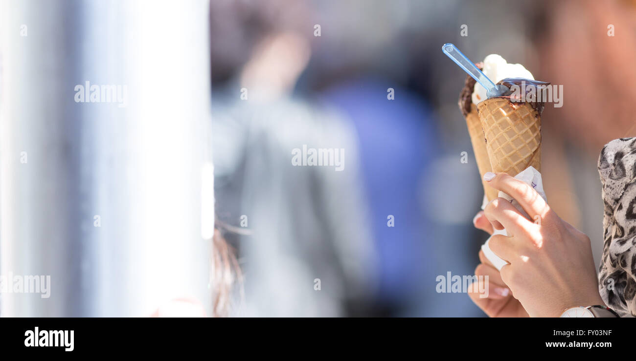 People eating an ice cream outdoor in the street, urban concepts Stock ...