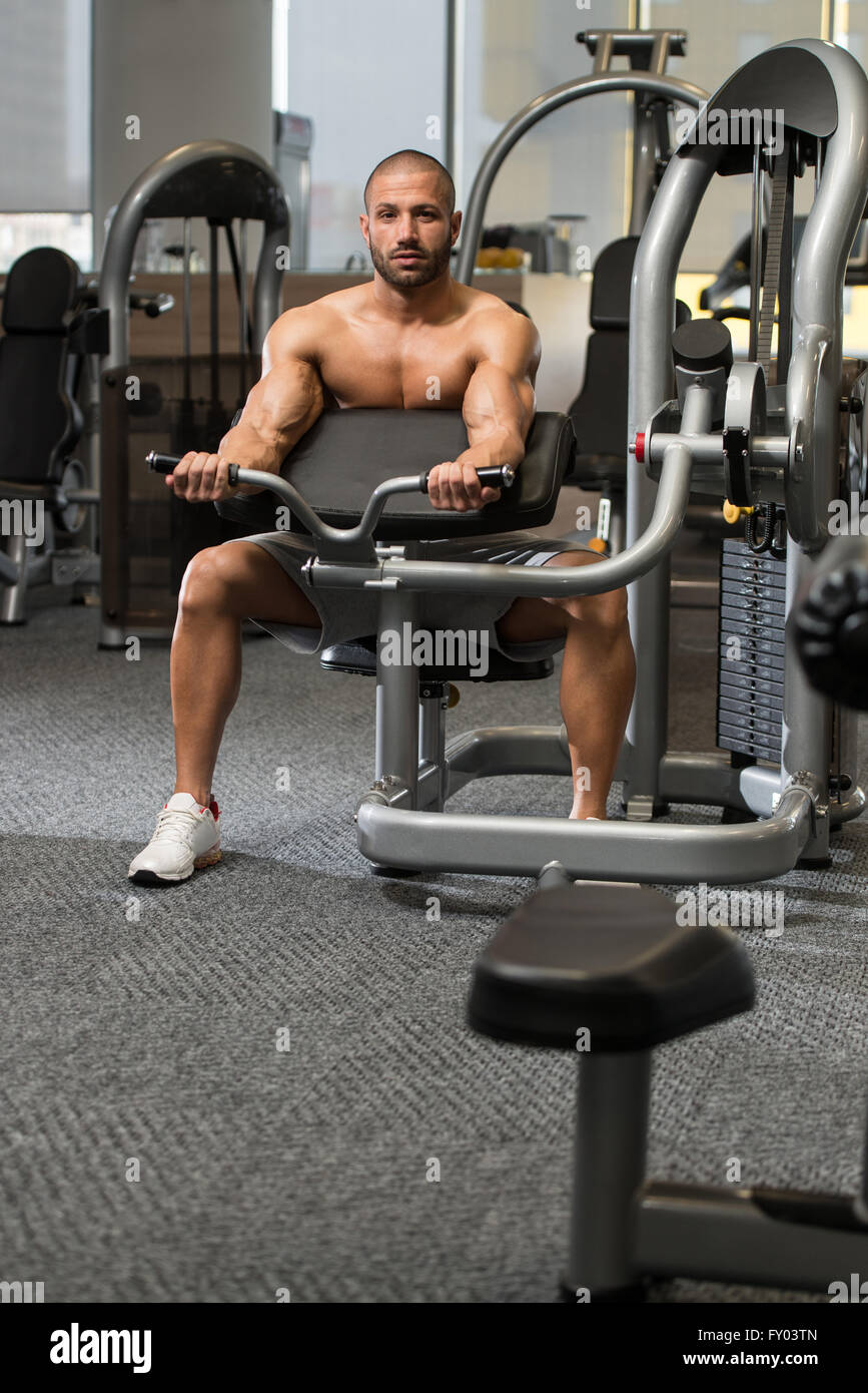 Young Bodybuilder Doing Heavy Weight Exercise For Biceps Stock Photo ...