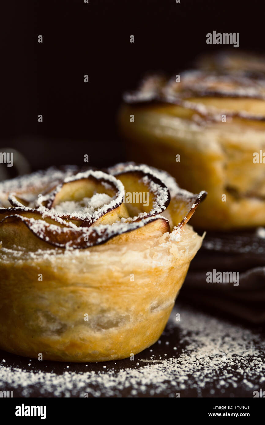 mini apple roses puff pastry with icing sugar Stock Photo - Alamy