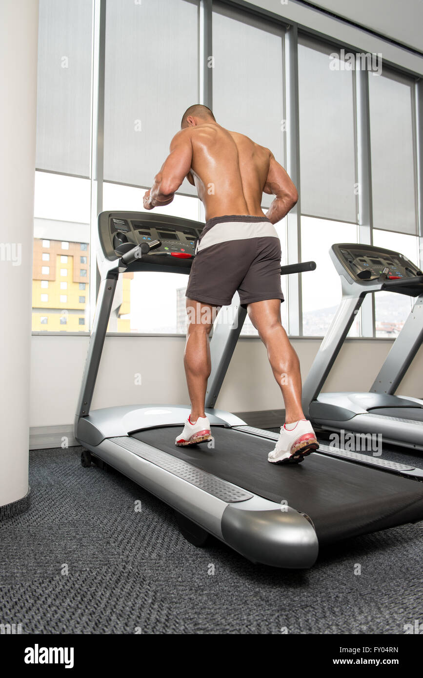 Handsome Man Running On The Treadmill In Gym Stock Photo - Alamy