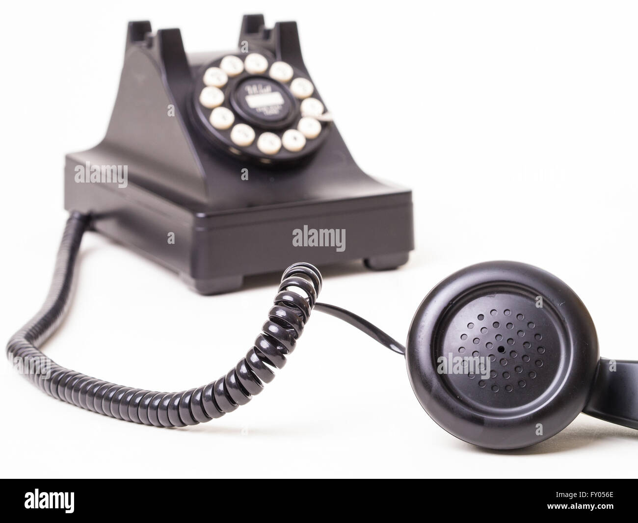 Old fashioned telephone with receiver off the hook Stock Photo - Alamy