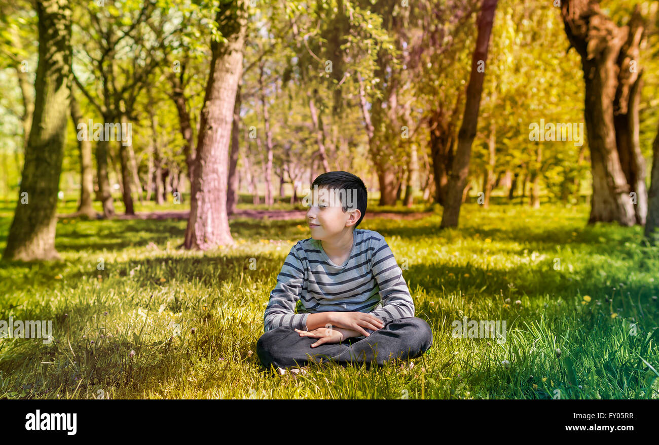 Young boy in the green nature Stock Photo - Alamy