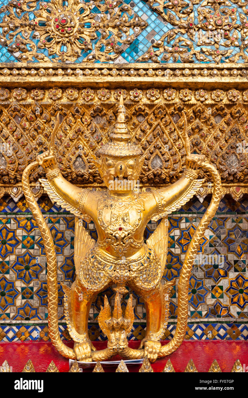 Golden wall decor at the Grand Palace in Bangkok, Thailand Stock Photo ...