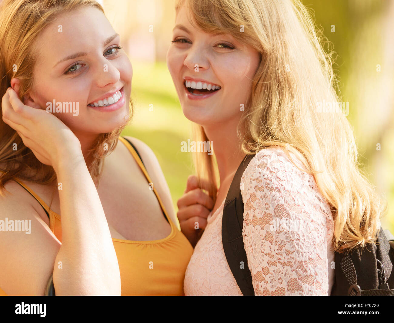 Happy smiling young women outdoor. Pretty attractive girls portrait ...