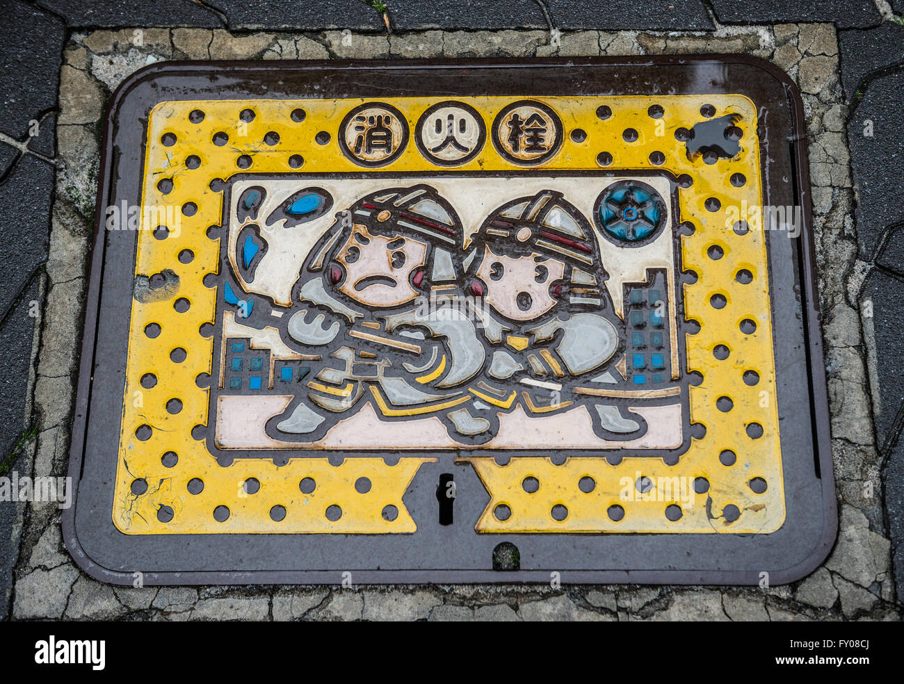 Decorated locked cover of ground fire hydrant in Tokyo city, Japan ...