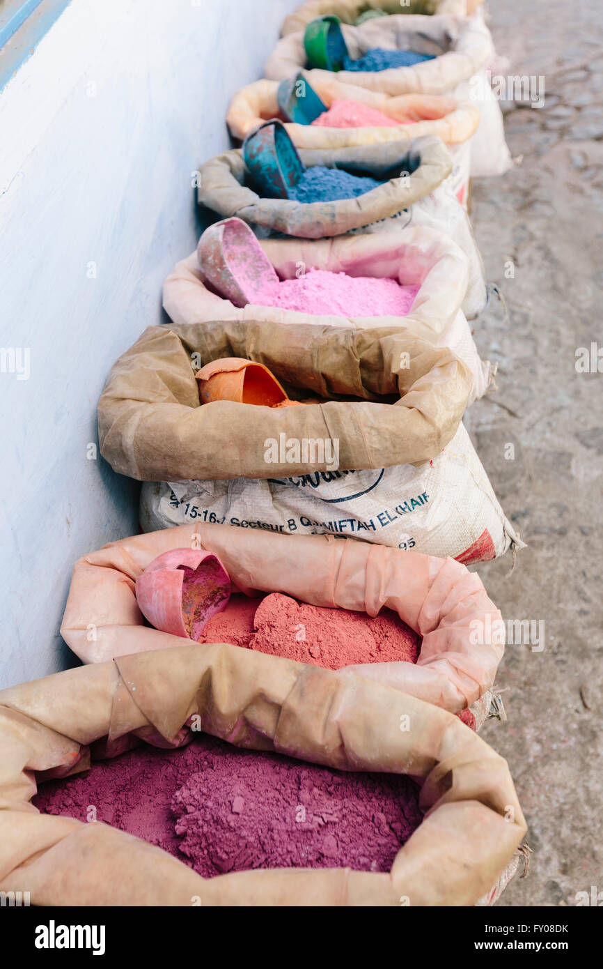 Colourful sacks of paint powder that is used to paint the houses of ...
