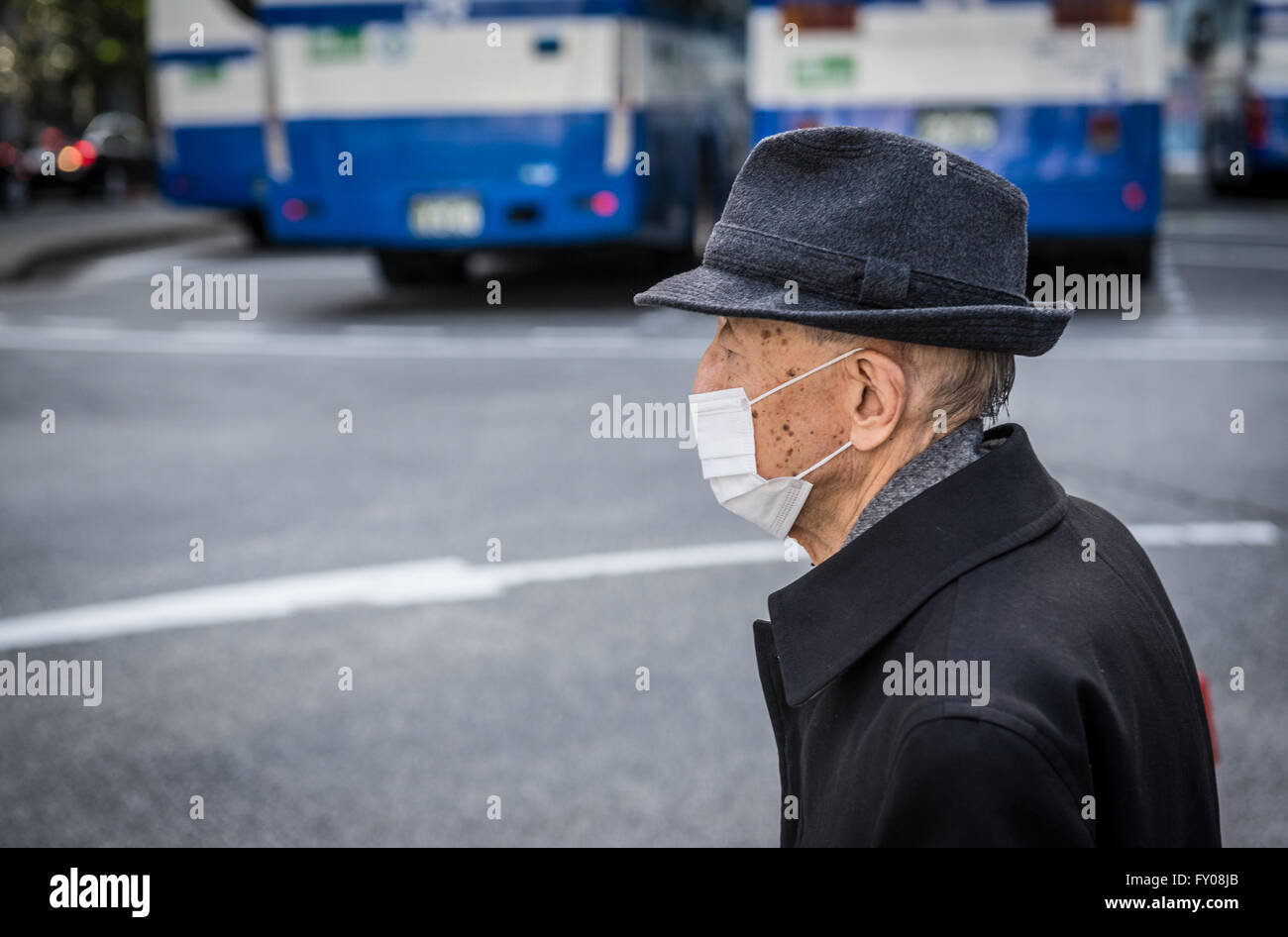 Old man with mask in Tokyo city, Japan Stock Photo - Alamy