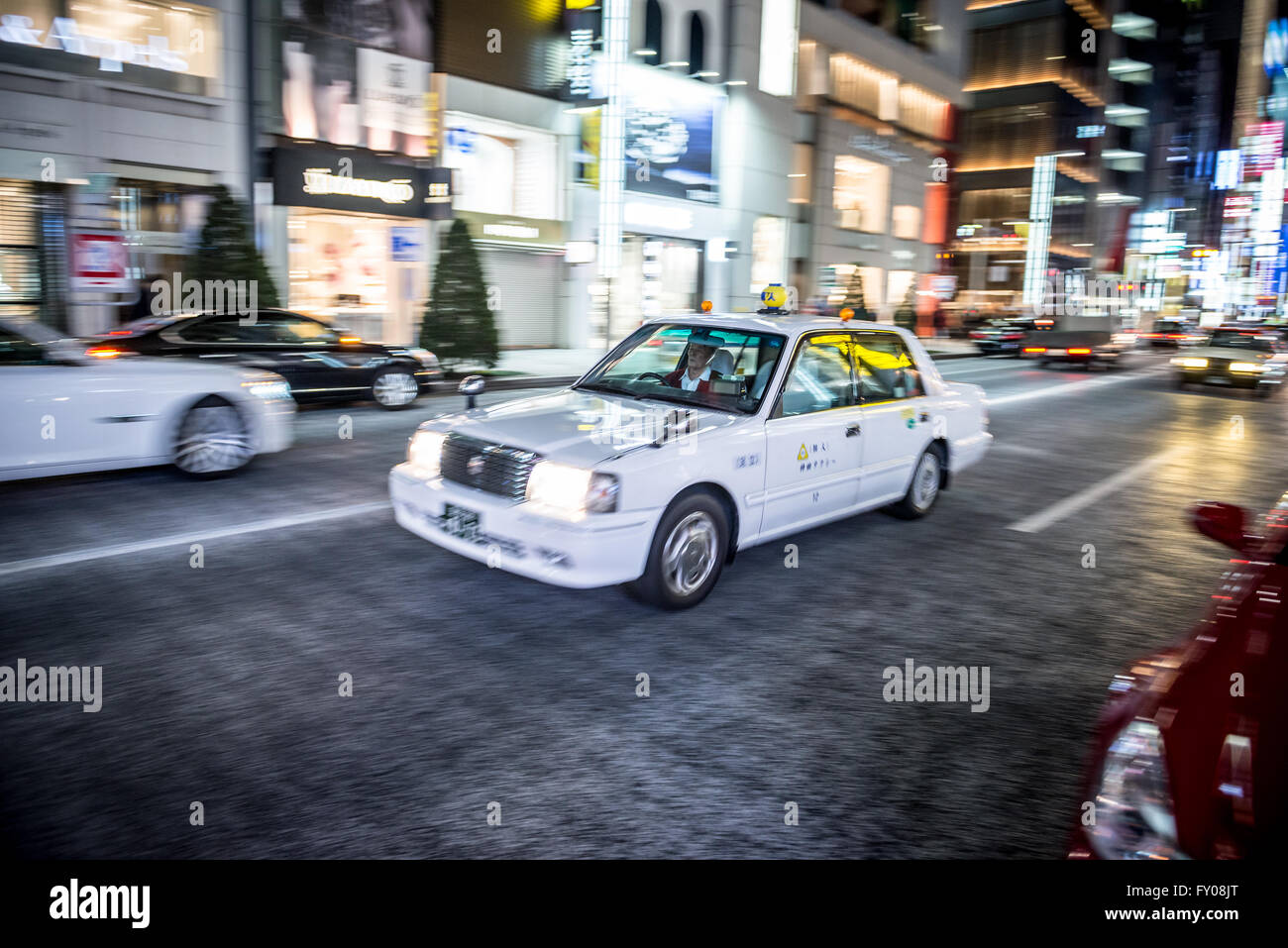 Toyota Crown taxi on Chuo Dori street in Ginza luxury district of Chuo ...