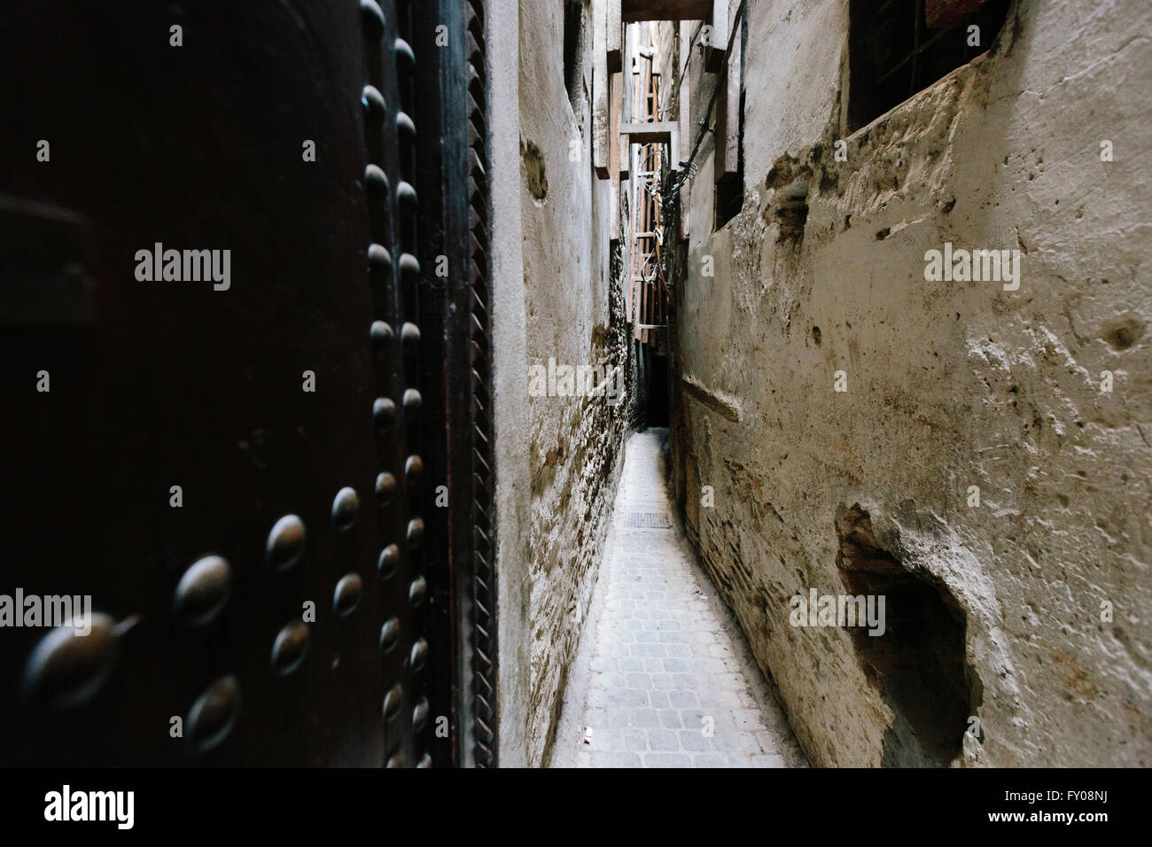 A typical alley in Fes, Morocco. The alleys are often so narrow that a ...