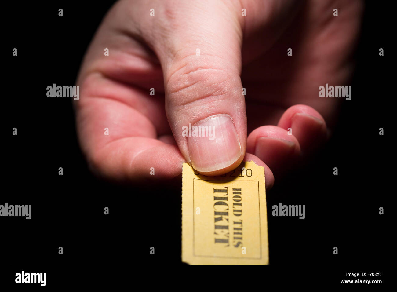 Black hands holding ticket hi-res stock photography and images - Alamy