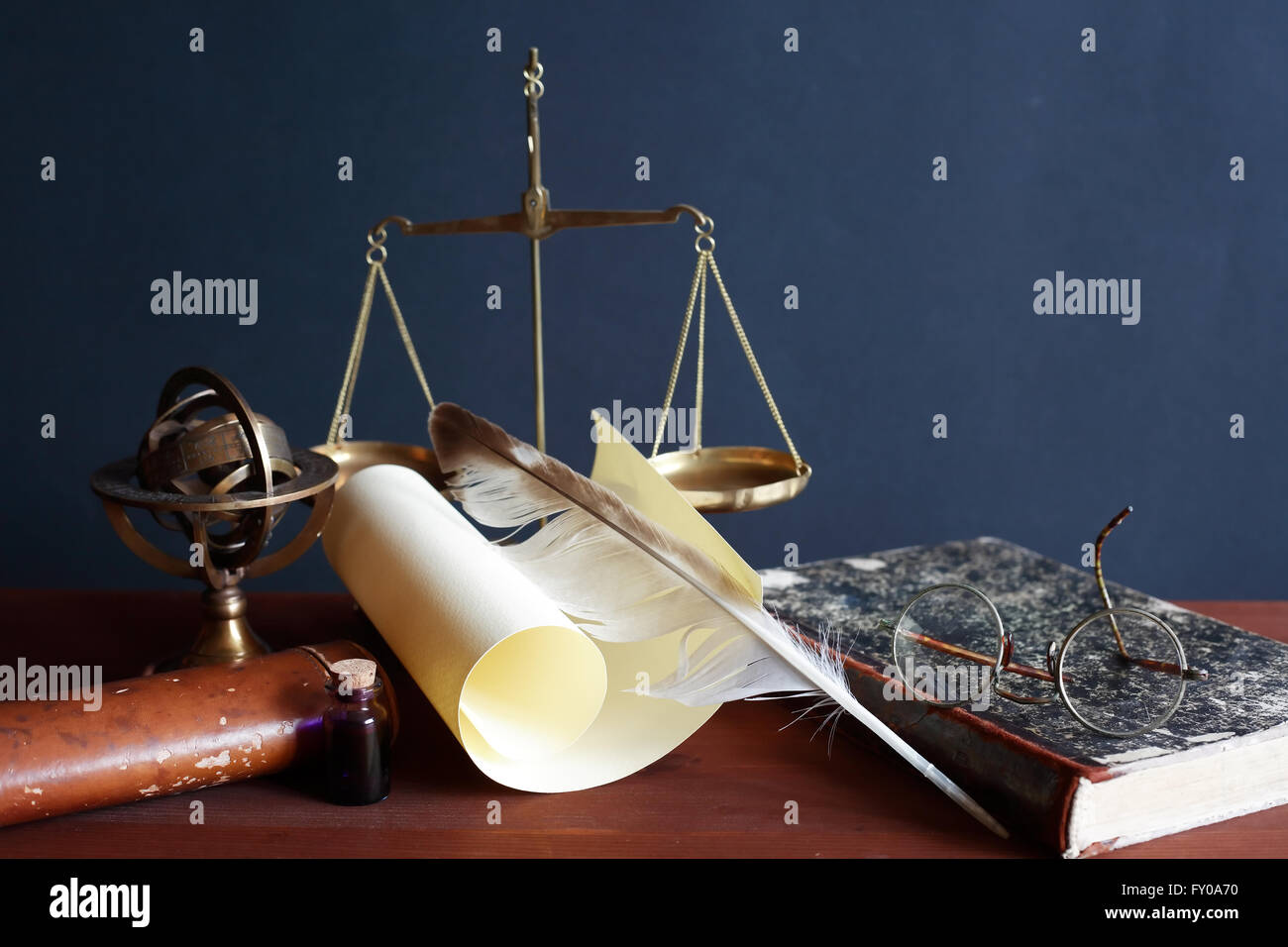 Vintage still life. Old weight scale near scroll and other vintage ...