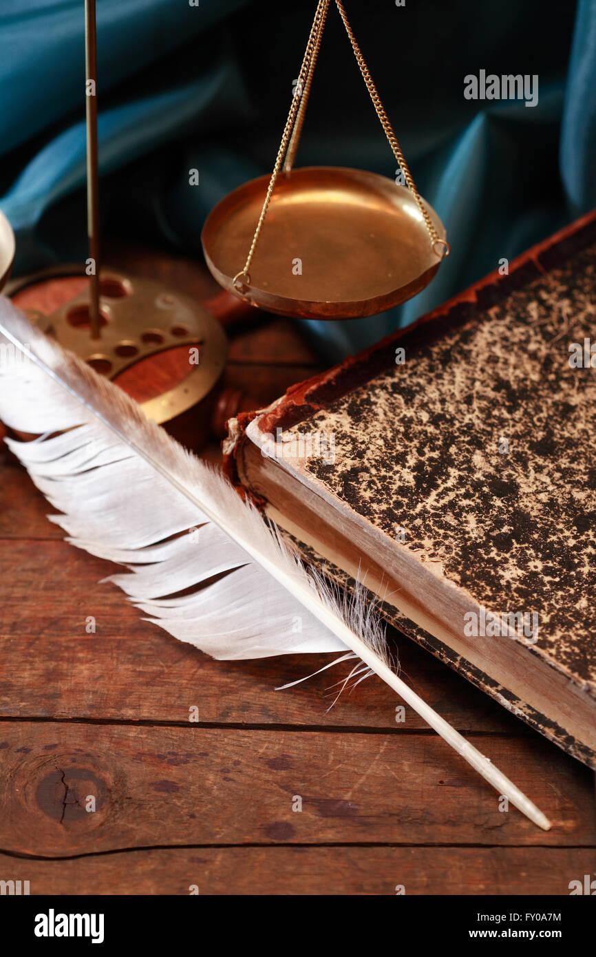Vintage still life with quill near old book and weight scale Stock ...