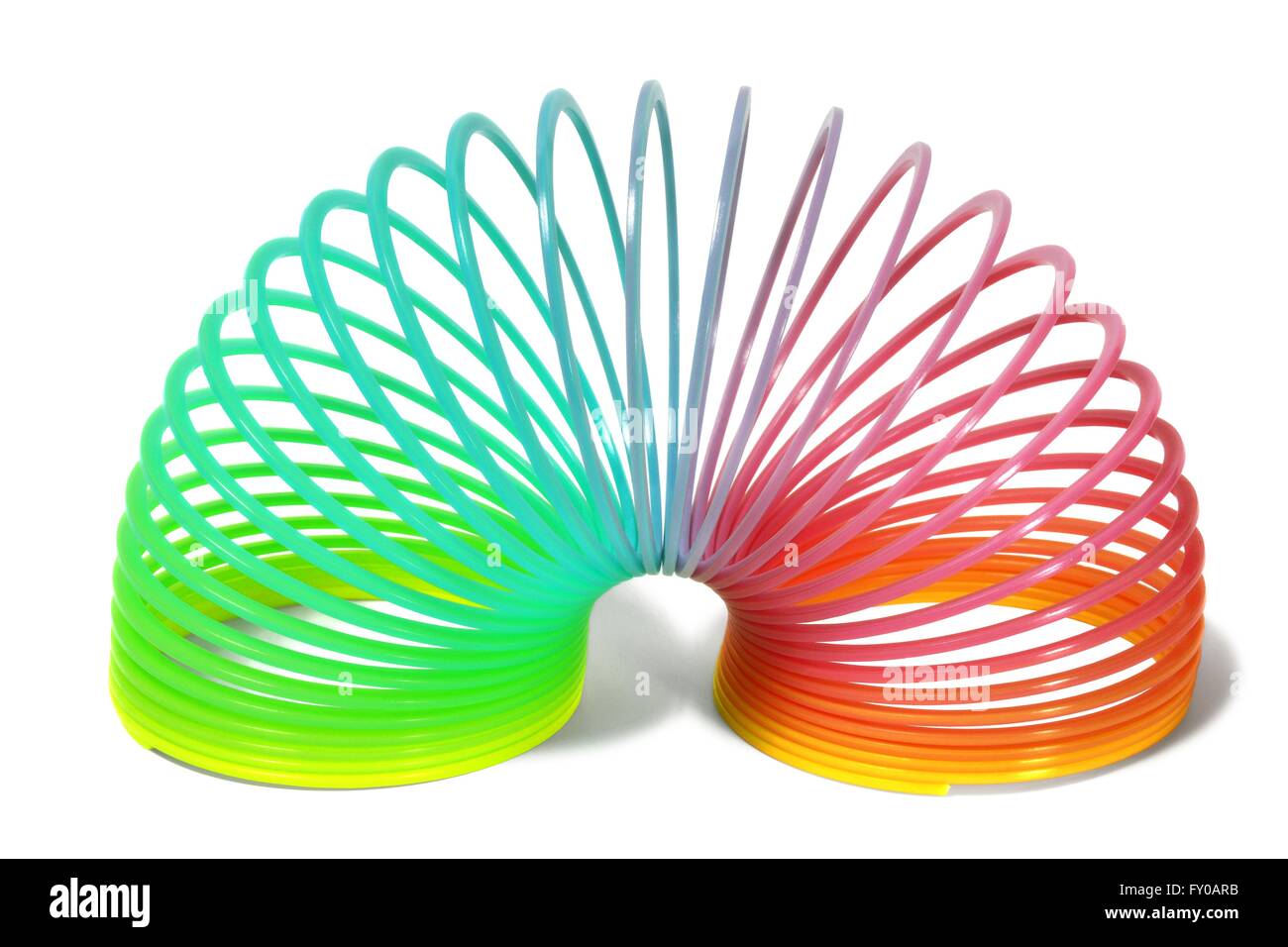 Rainbow walking spring isolated on white background Stock Photo - Alamy