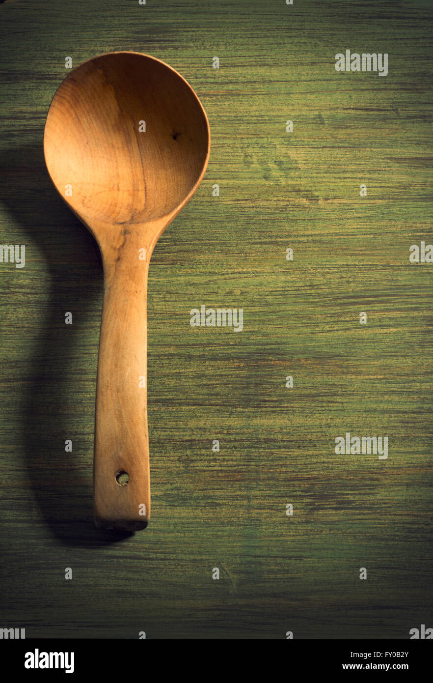 Wooden kitchenware on green background, texture for menus and cooking ...