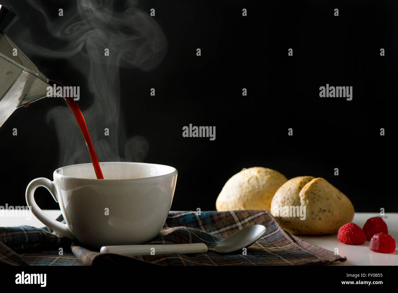 serving hot coffee in the living room of his home, black background ...