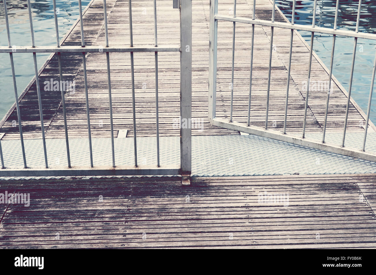 Jetty gate slightly open Stock Photo - Alamy