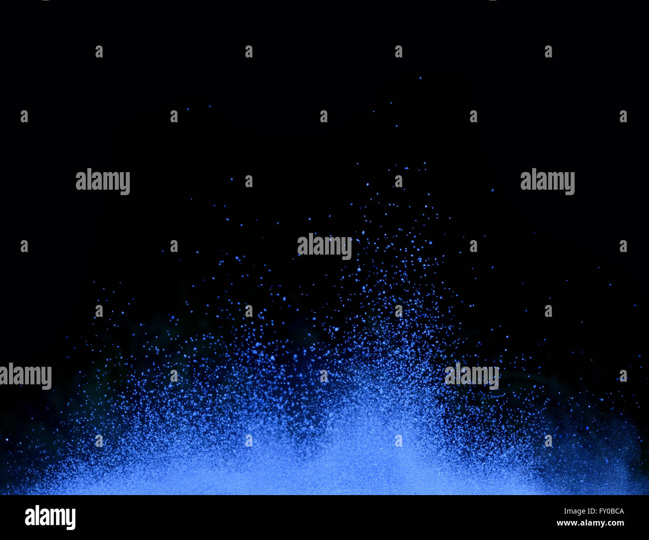 Explosion of blue powder on black background Stock Photo - Alamy