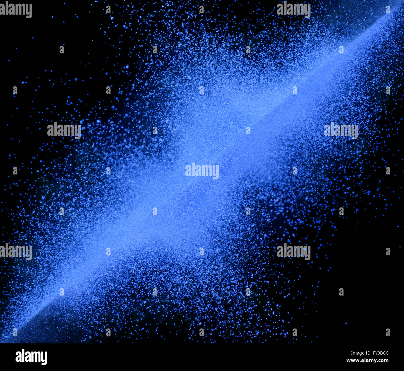 Explosion of blue powder on black background Stock Photo - Alamy