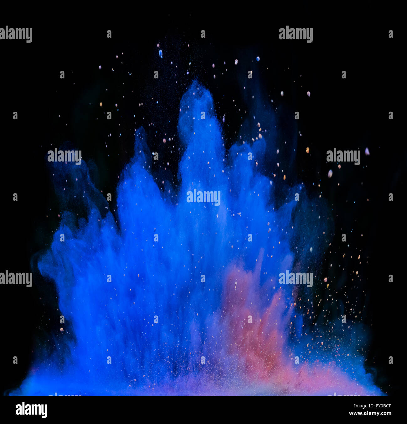 Explosion of colored powder on black background Stock Photo - Alamy