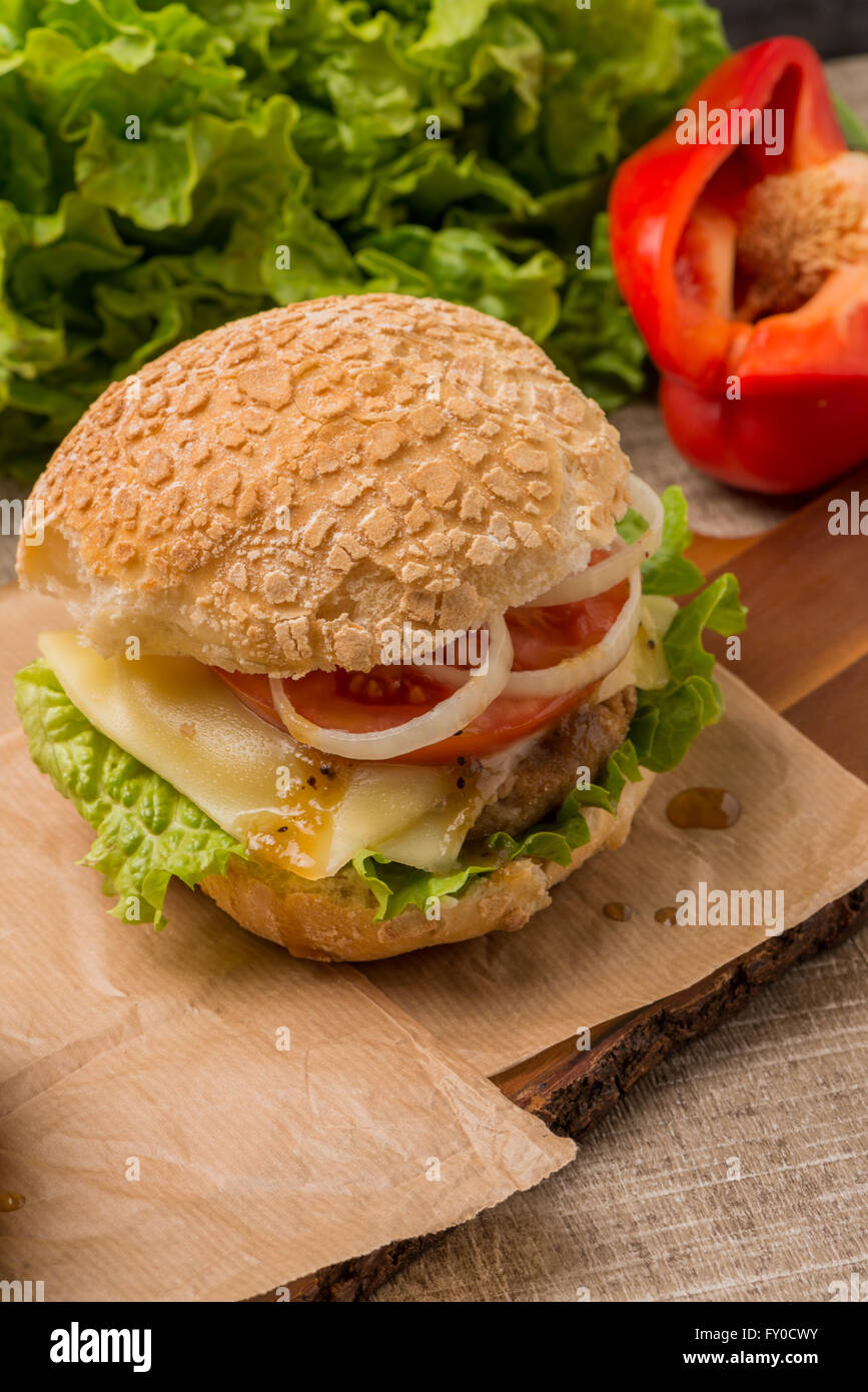 Homemade veggie burger served on wooden table Stock Photo - Alamy