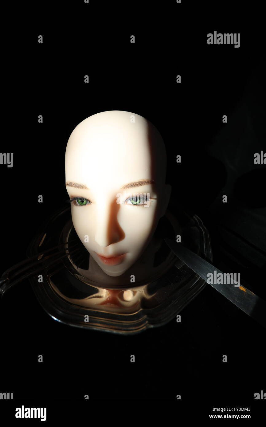 Solitaire silicone head on silver platter, black background Stock Photo ...