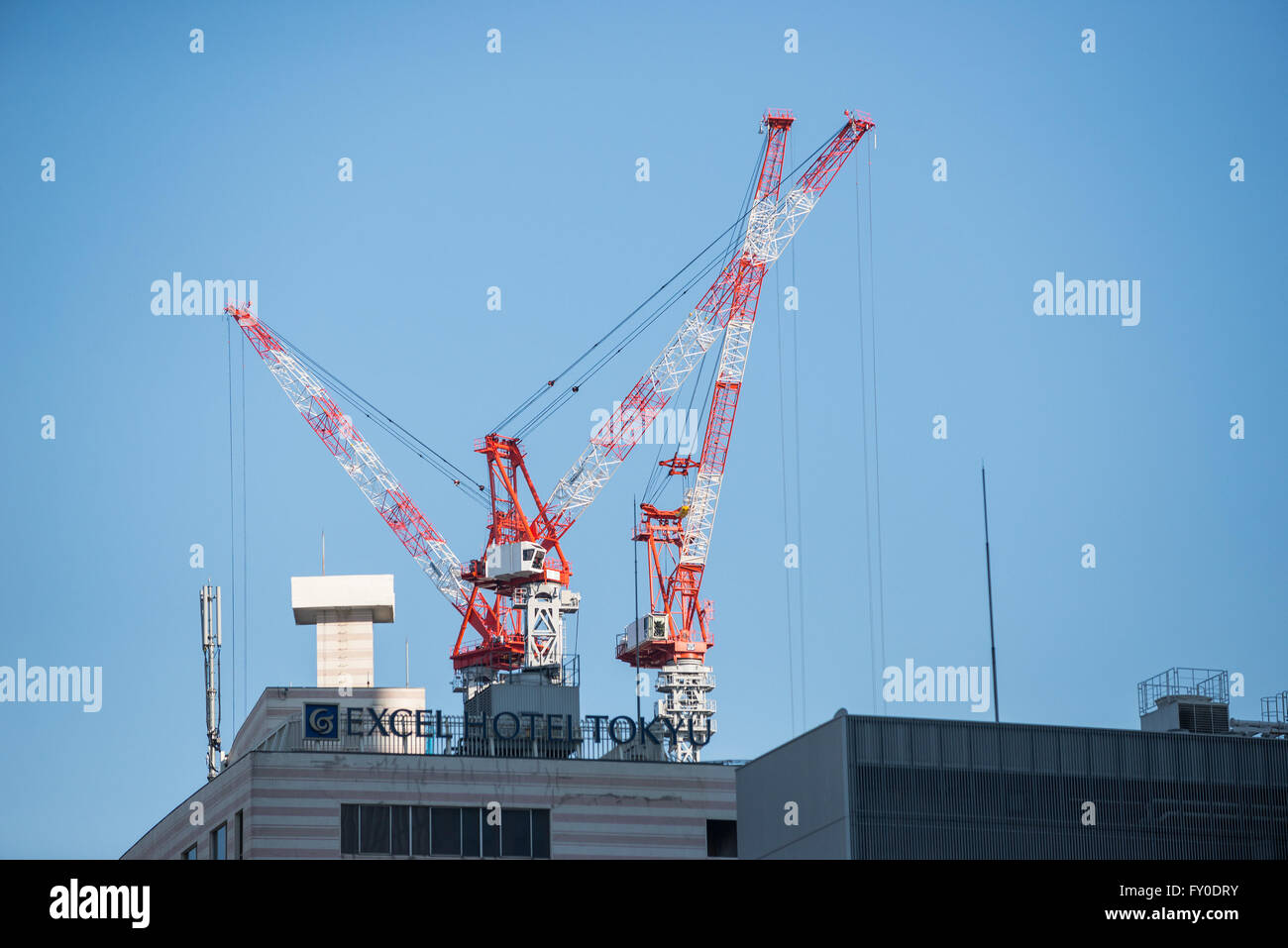 Building cranes in Akasaka, Minato district in Tokyo city, Japan Stock ...