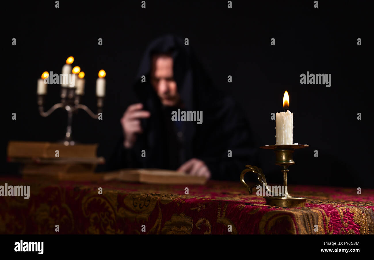 Old monk reading hi-res stock photography and images - Alamy