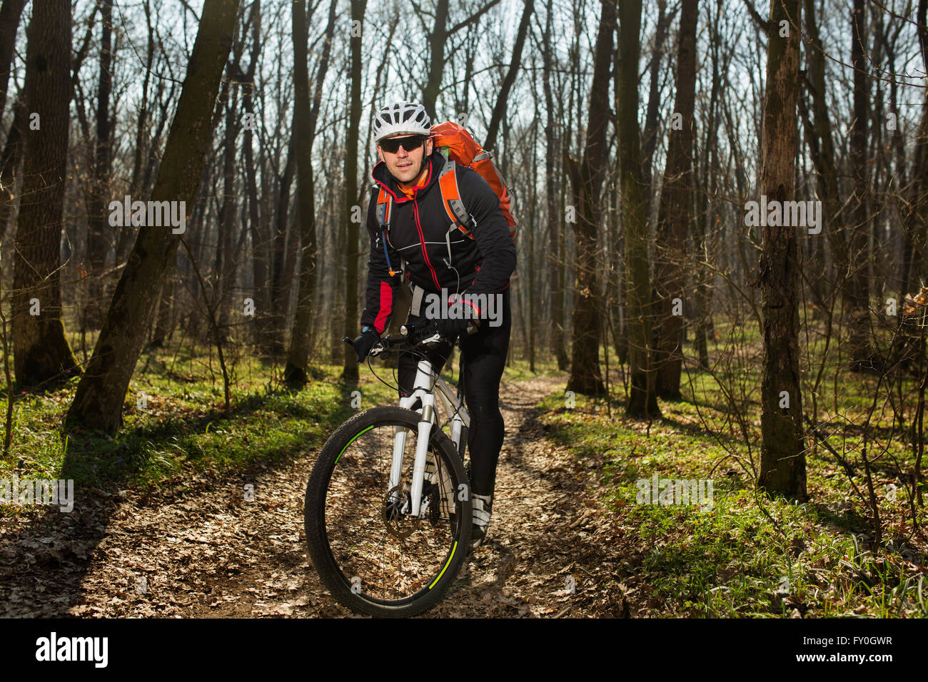 Man cyclist riding the bicycle Stock Photo - Alamy