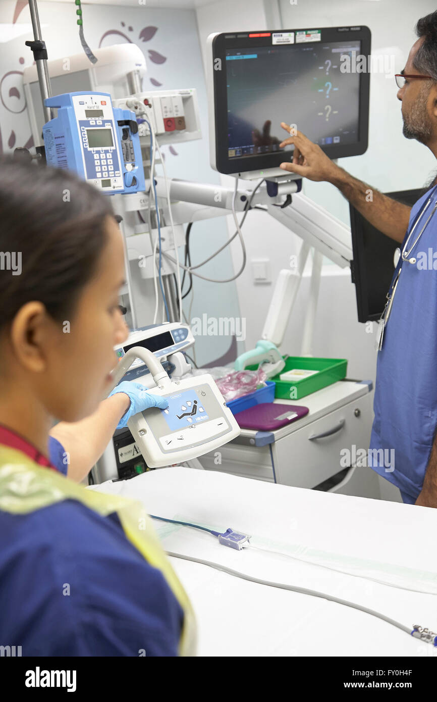 Nurse preparing bed in hi-res stock photography and images - Alamy