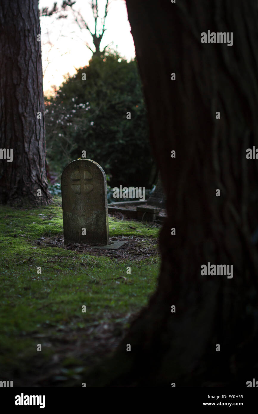 A church graveyard with stone memorials, crosses and gravestones Stock ...