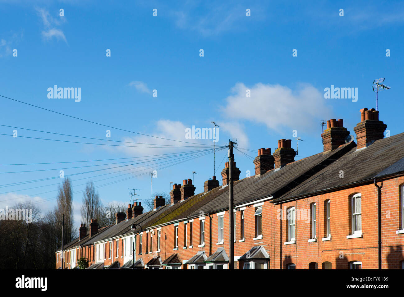 Street of red brick terraced house with blue sky Stock Photo - Alamy