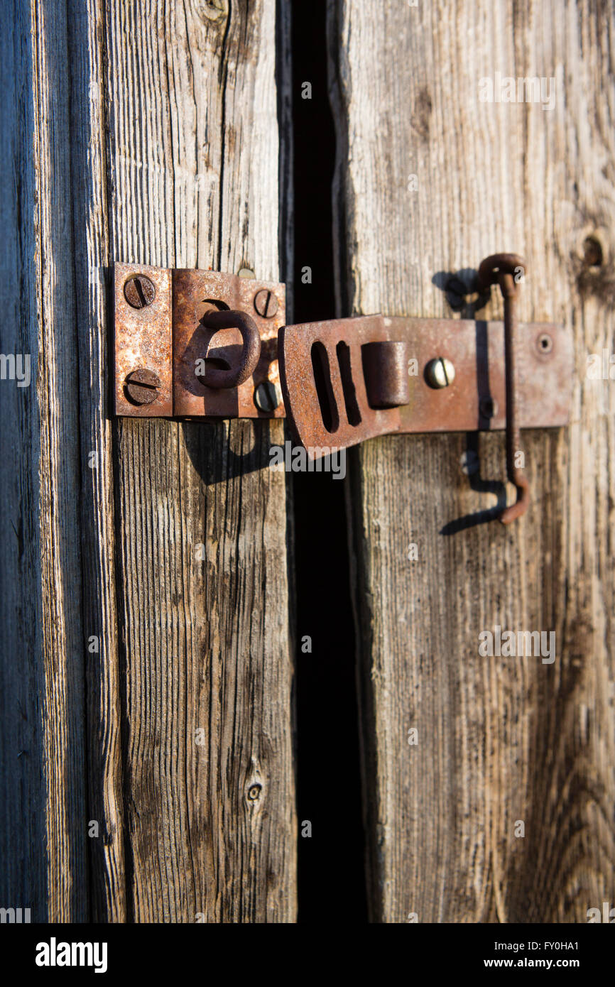 Old weathered wooden door with rusty old lock Stock Photo - Alamy
