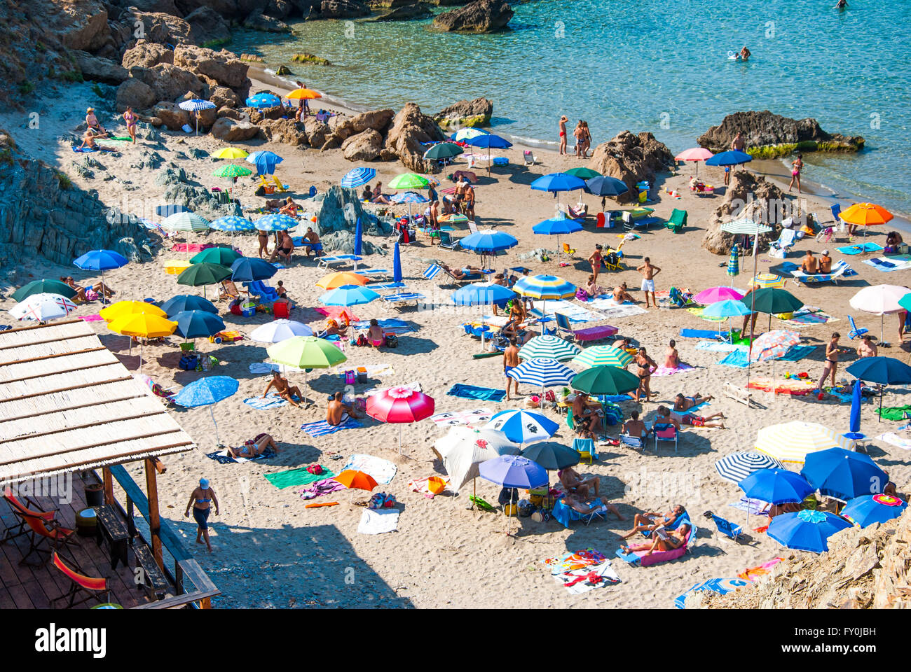Masua Beach, Italy - August 19: Masua Beach in Nebida crowed in ...