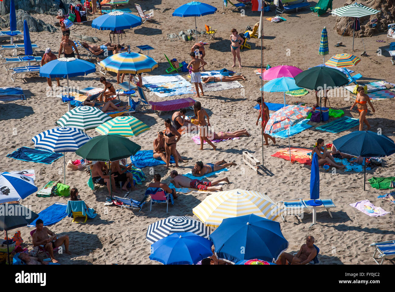 Masua Beach, Italy - August 19: Masua Beach in Nebida crowed in ...