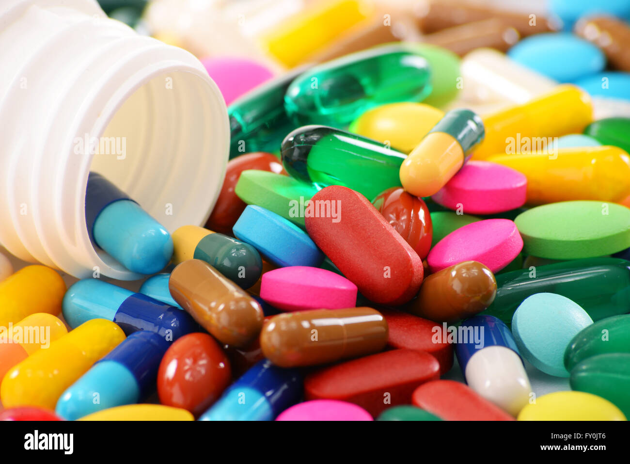 Composition with variety of drug pills and container Stock Photo - Alamy
