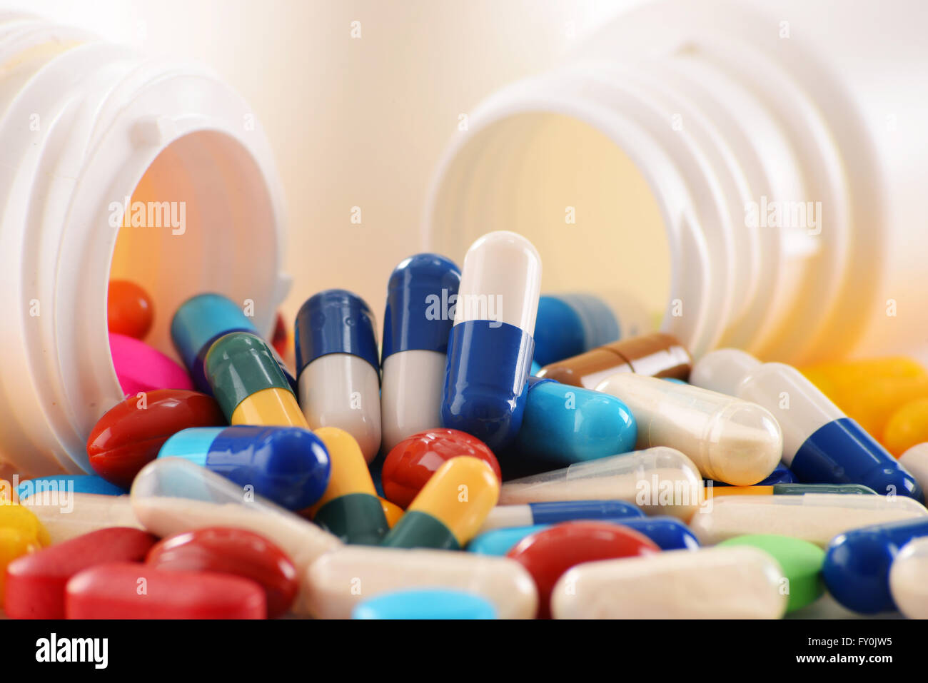 Composition with variety of drug pills and container Stock Photo - Alamy