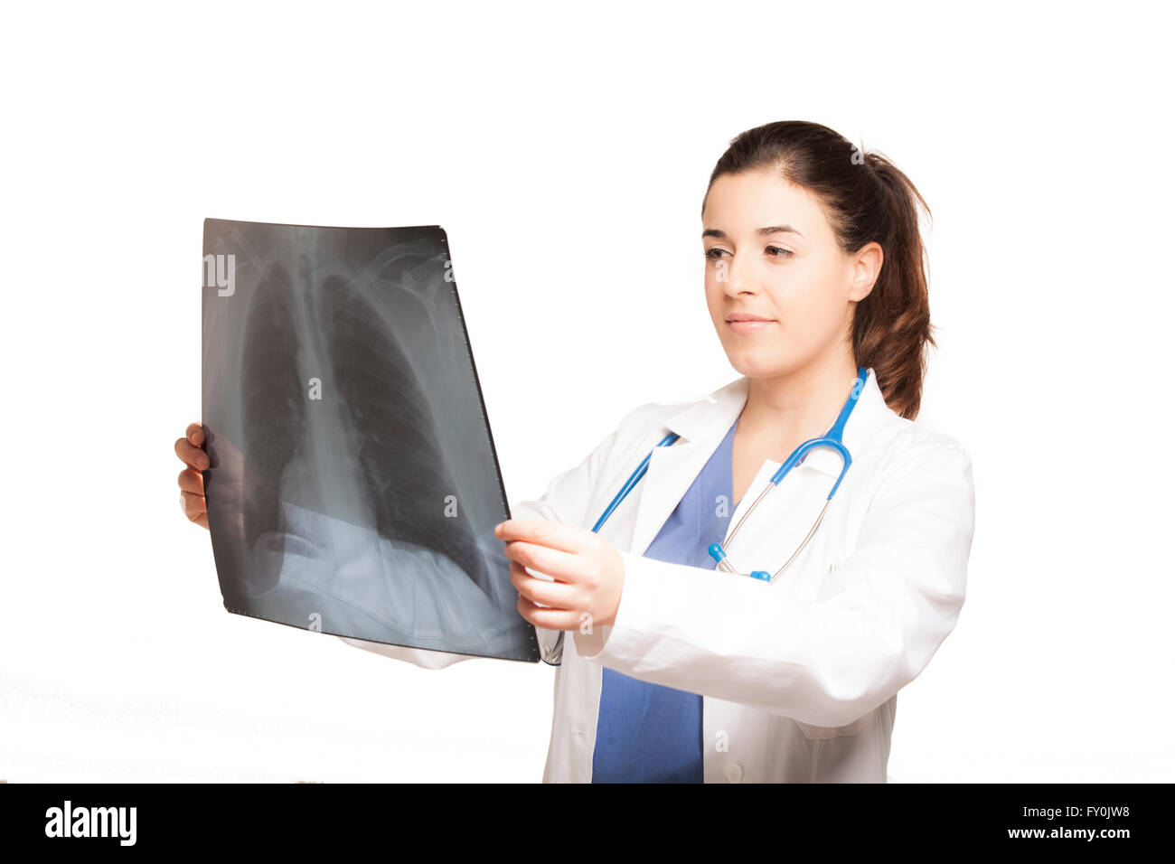 Caucasian young female doctor looking at a radiography isolated on ...