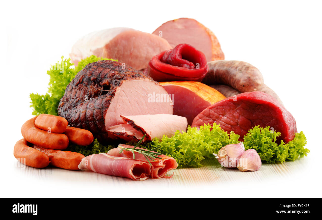 Assorted meat products including ham and sausages isolated on white ...