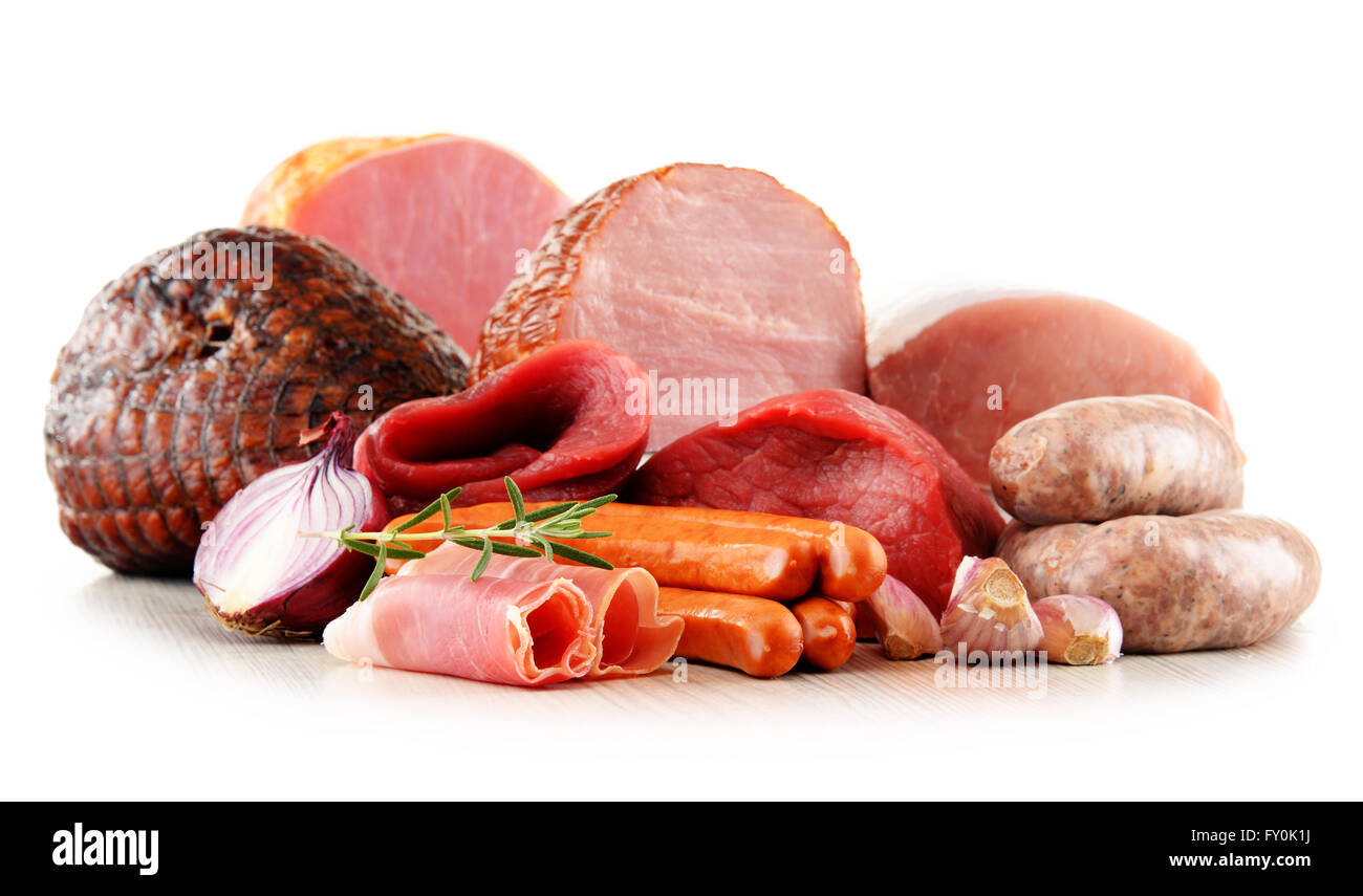 Assorted meat products including ham and sausages isolated on white ...