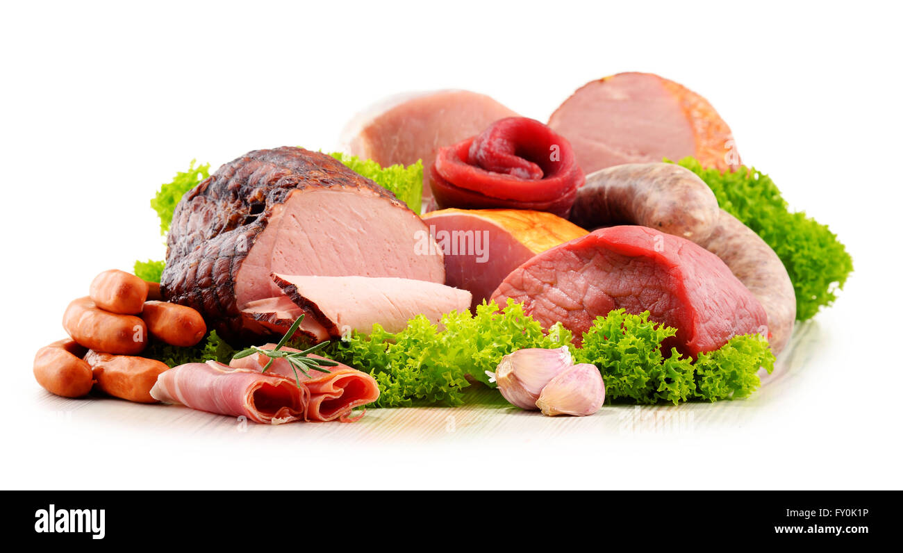Assorted meat products including ham and sausages isolated on white ...