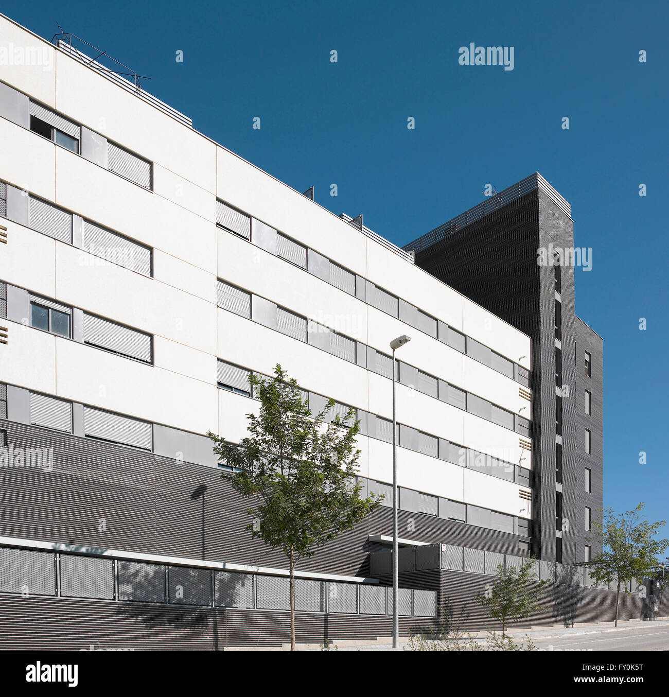 Residential building facade in white and grey tone. Square format Stock ...