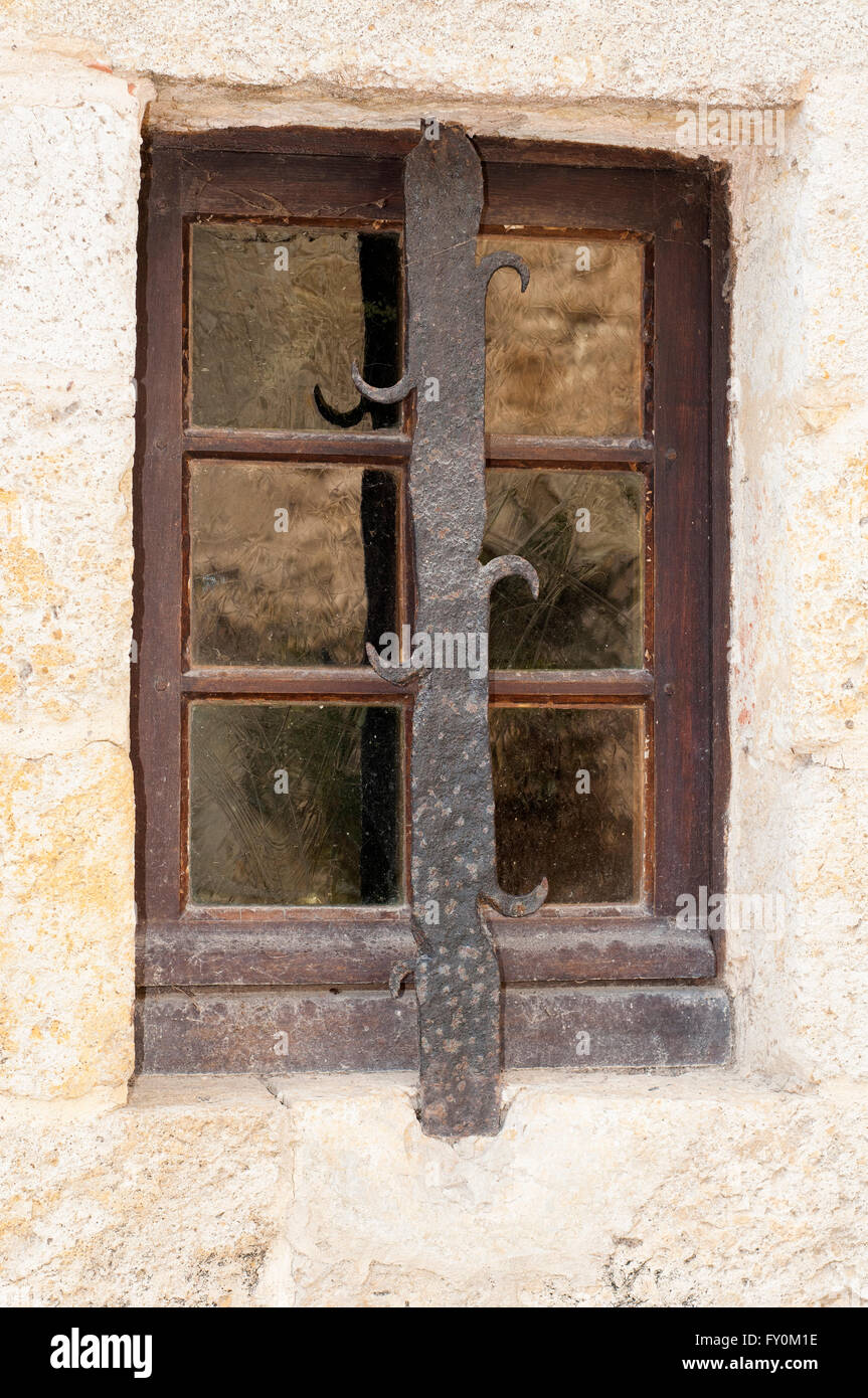 Old window inside the medieval fortified city of Larressingle. Gers ...